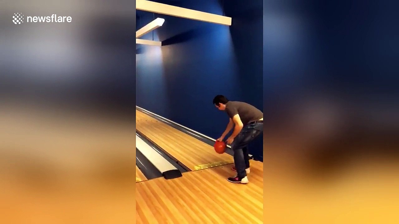 Man's fingers get stuck in bowling ball as he goes bowling for the ...