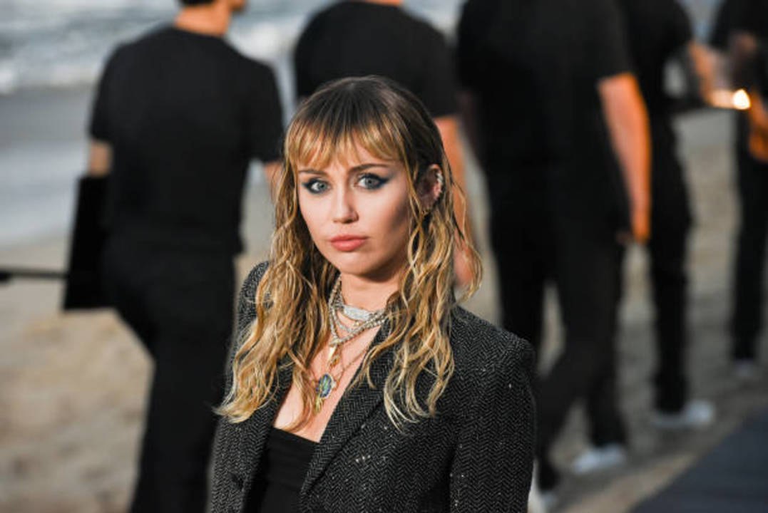 Miley Cyrus Wore a Bright Purple See-Through Suit to Encourage ...