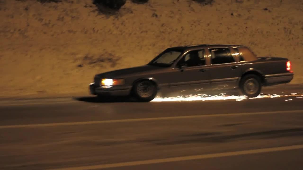 Sparks Fly as Car's Tire Punctures and Rim Drags on the Road - video ...