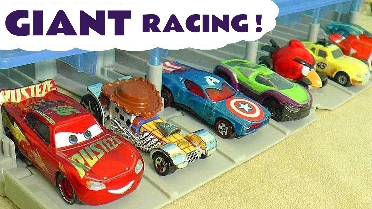 Giant Racing with Pixar Cars 3 Lightning McQueen versus Hot Wheels Cars ...
