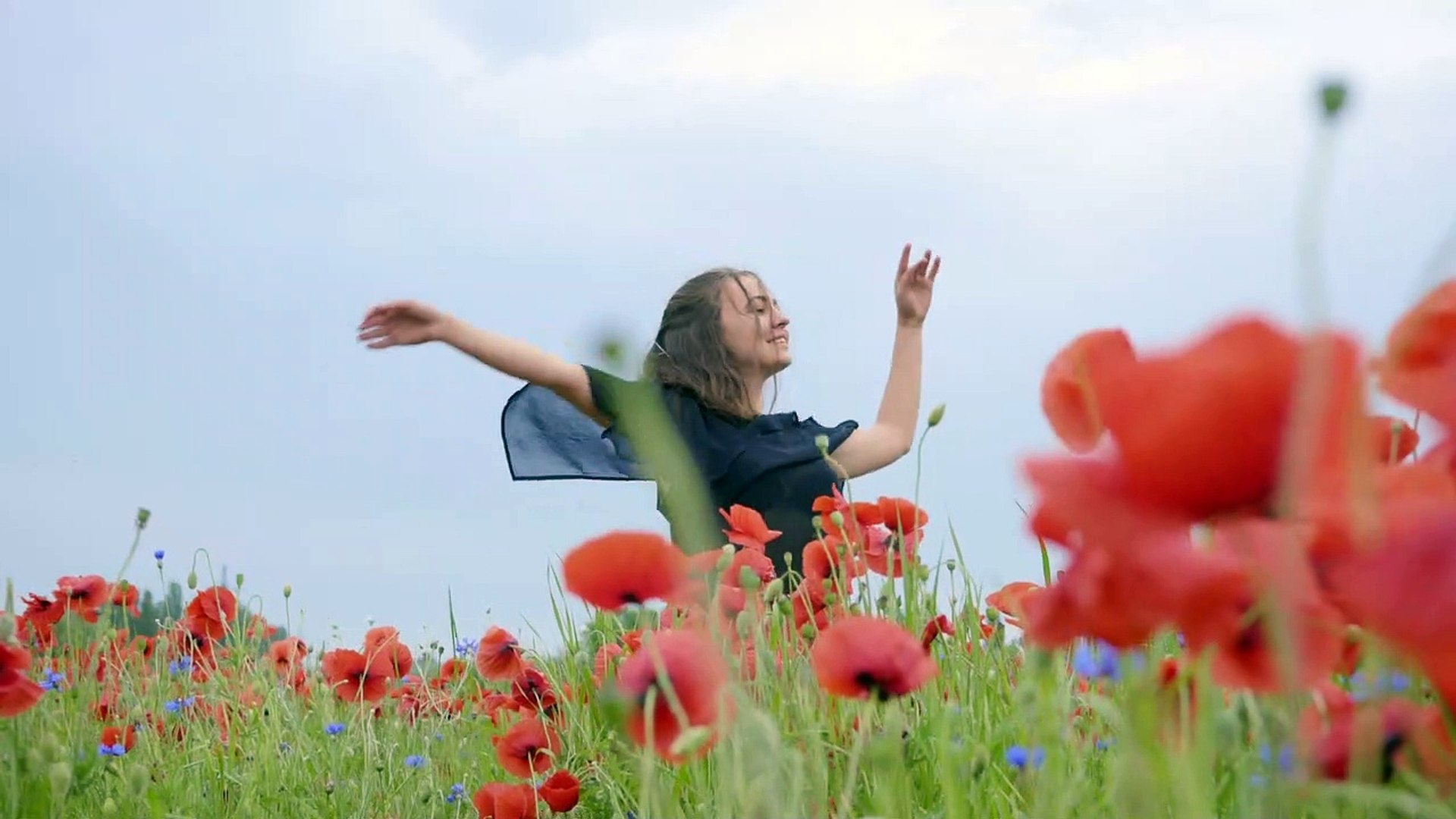 Girl Dancing In Field Of Flowers