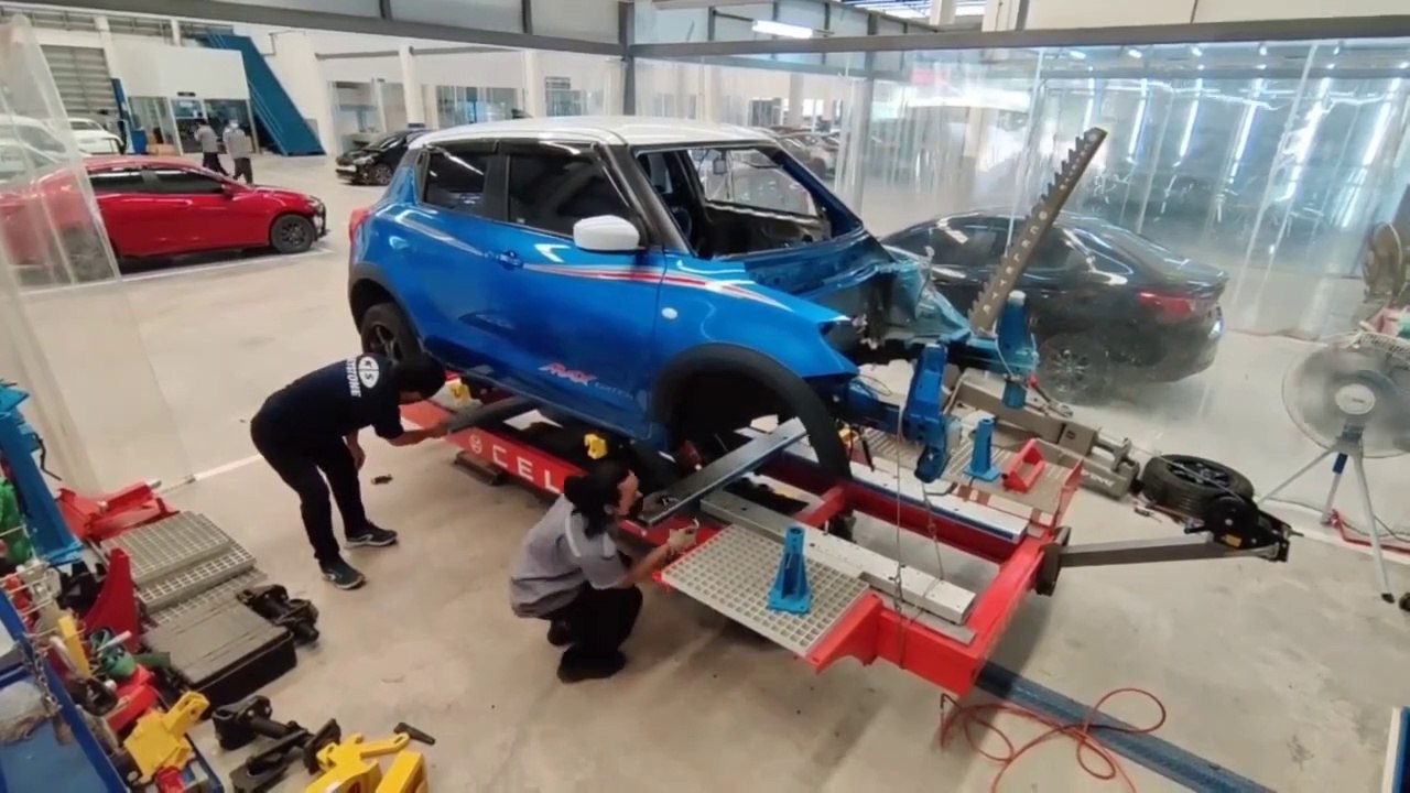 Front rail and strut tower repair on Celette bench with Universal Jigs ...