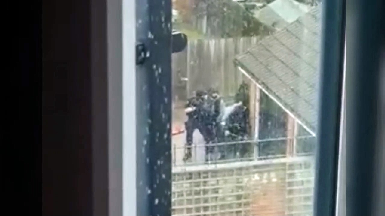 Armed police raid 'hostage' house