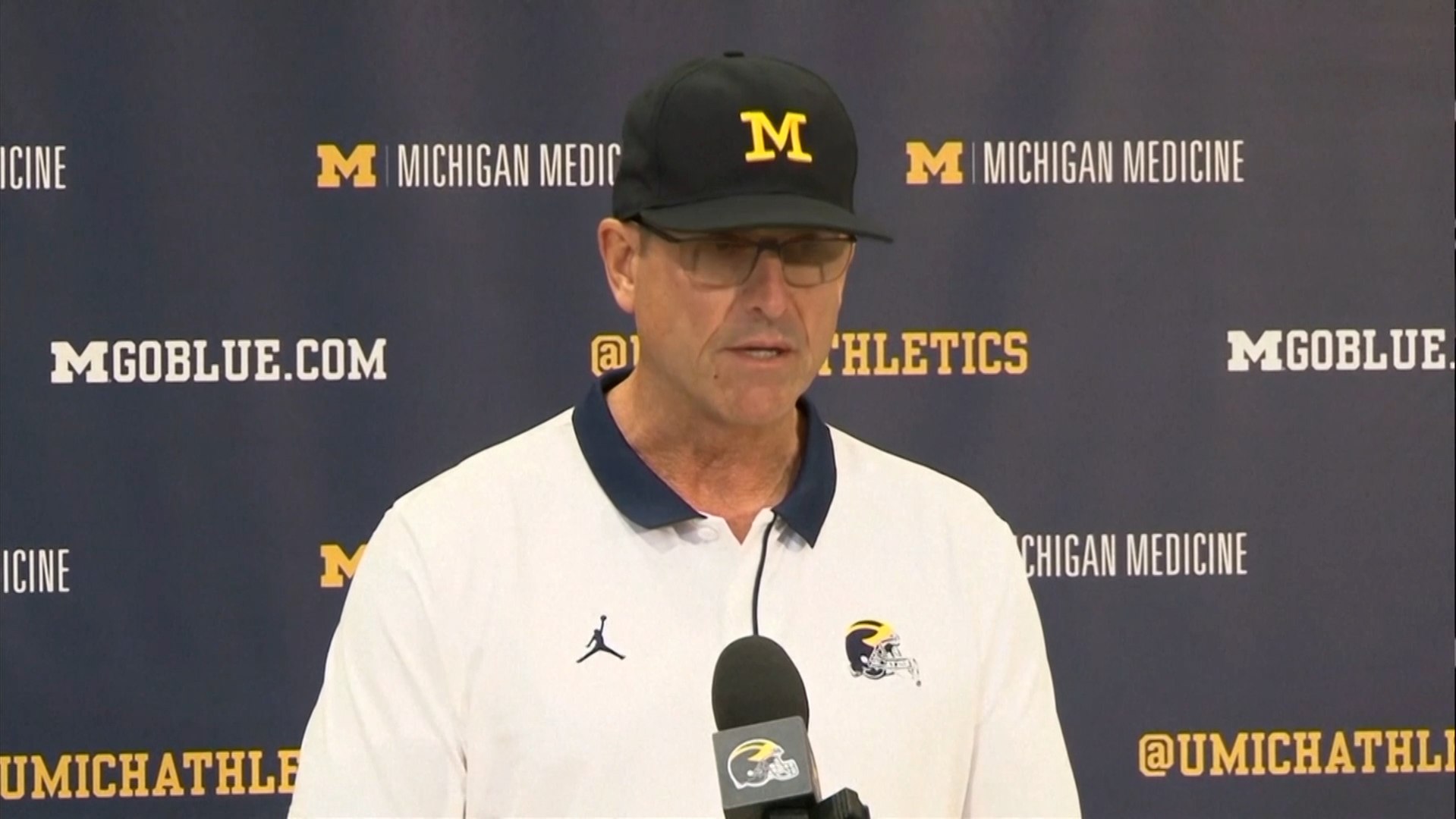 Michigan coach Harbaugh calls for criminal charges after 'sickening ...