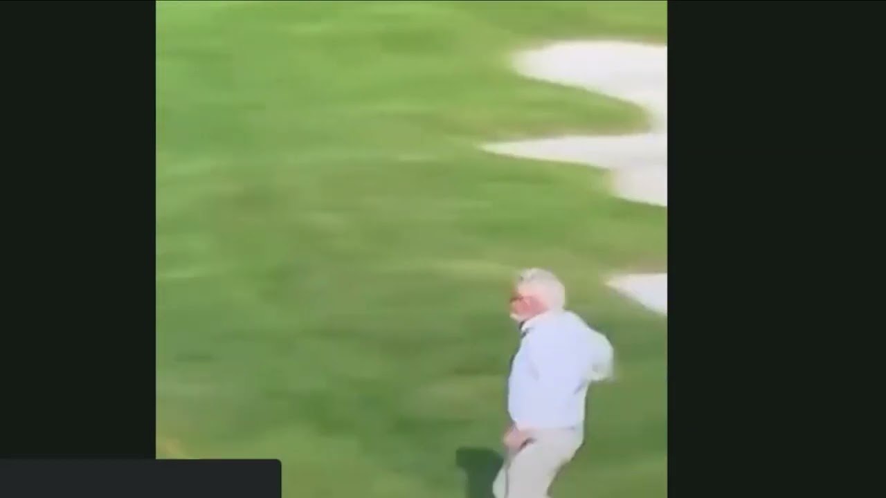 ‘Colonel Sanders’ evades security and sprints across green and jumps in ...