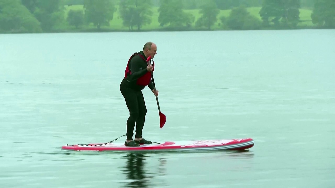 UK Liberal Democrat leader Ed Davey falls off paddle board - video ...