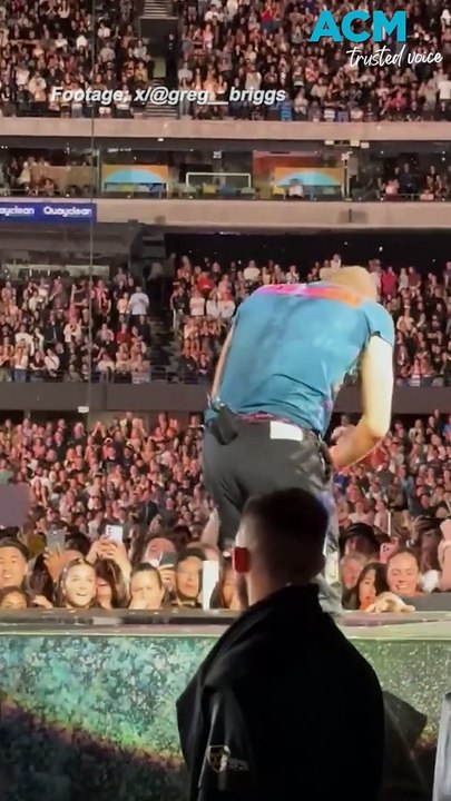 Coldplay singer Chris Martin falls through stage in Australia - video ...