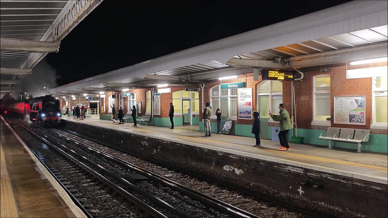 Steam train looking majestic alongside modern train at Worthing railway ...