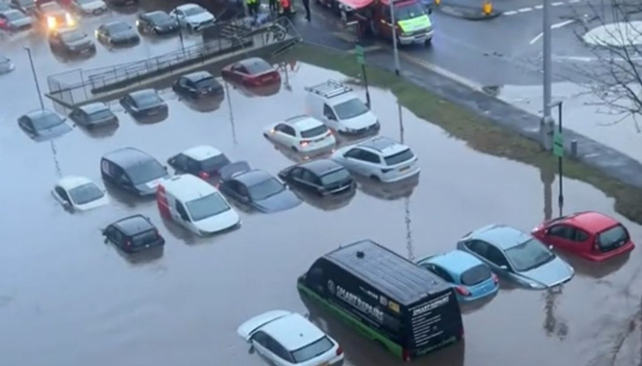 Stockport flooding: People trapped in flats with car park submerged ...